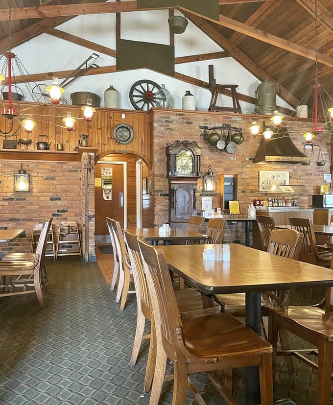 Exposed brick walls, wooden beams, and antique decor create a warm, rustic atmosphere that feels genuinely lived-in rather than manufactured.