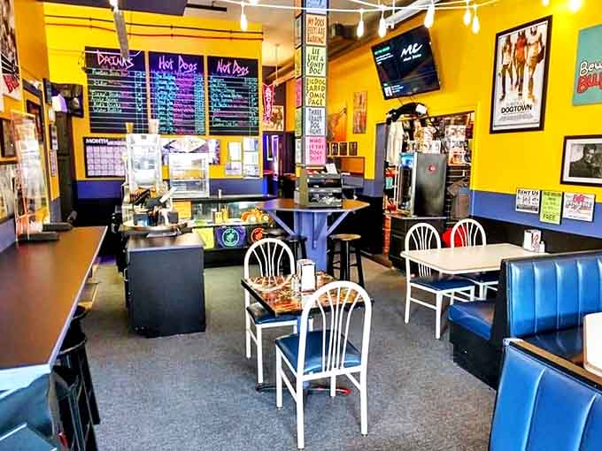 Interior: Sunshine-yellow walls and colorful menu boards create a cheerful command center for hungry heroes seeking refuge from ordinary dining.