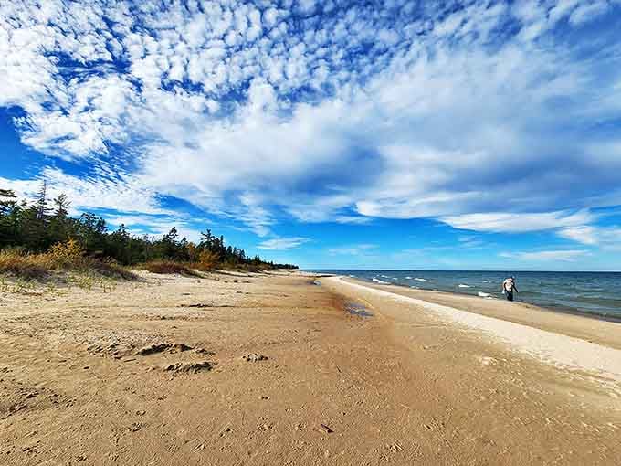 Agate Beach stretches into the distance, where treasure hunters comb the shoreline for colorful stones washed smooth by Lake Huron's gentle waves.