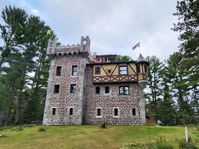 Kelley Castle emerges from the Wisconsin forest like a European transplant, its stone tower and Tudor-style elements creating a fairy tale silhouette.