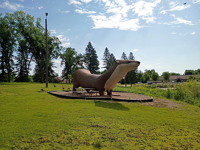Otto the Otter stretches his concrete body in the sunshine, welcoming visitors to Fergus Falls with his permanent smile.