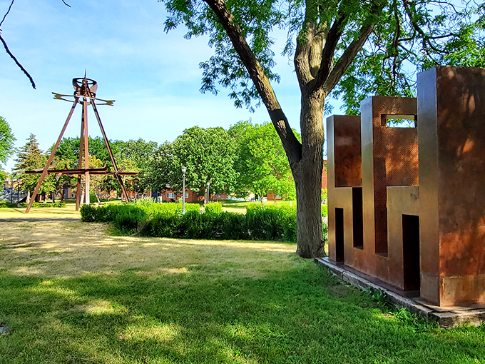 Metal towers reach skyward in Saint Paul's outdoor gallery, where art breaks free from museum walls to interact with nature and visitors alike.