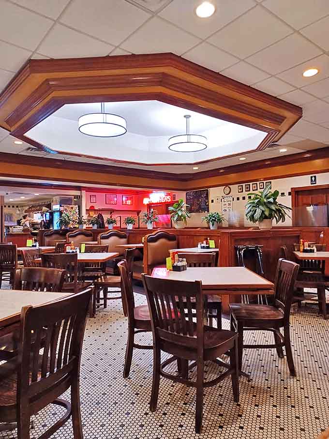 The warm wood-paneled interior with its distinctive octagonal ceiling creates an atmosphere that feels like stepping into a beloved time capsule.