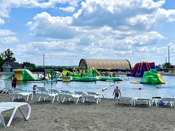 The beach area offers a perfect vantage point for watching others struggle with balance while you smugly sip your beverage from dry land.