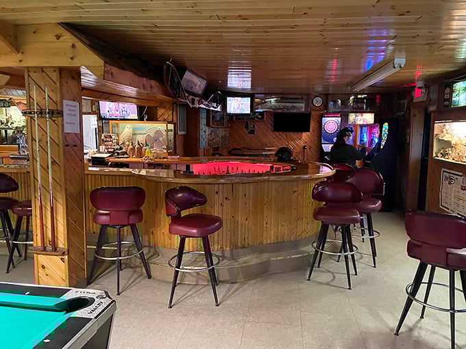The vintage wood-paneled bar area offers comfortable seating where patrons can enjoy drinks while surrounded by Wisconsin's preserved wildlife.