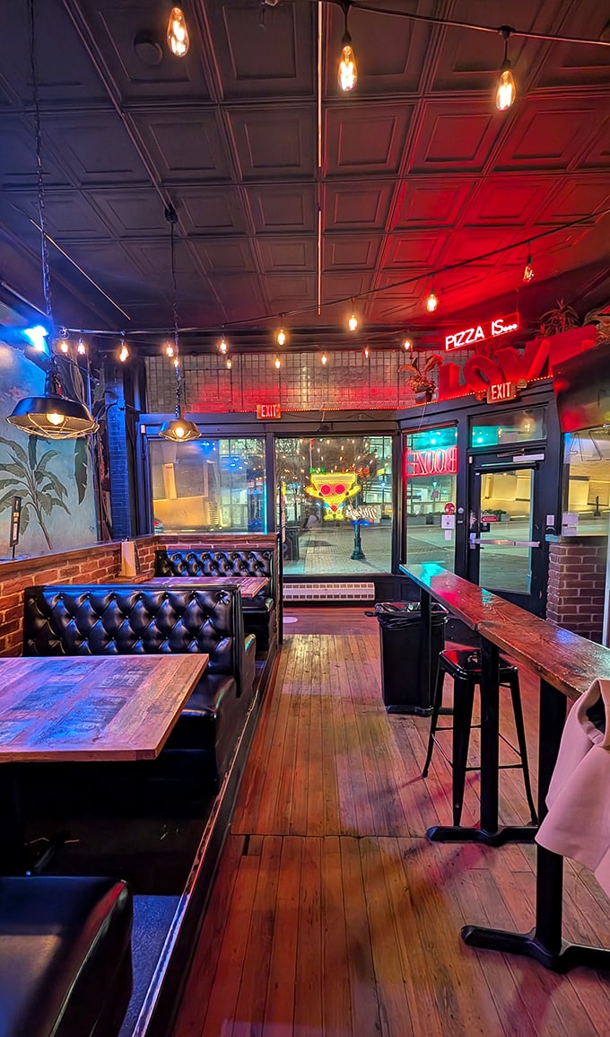 Leather booths invite lingering conversations under warm Edison bulbs &ndash; the perfect backdrop for pizza-fueled heart-to-hearts and spontaneous celebrations.