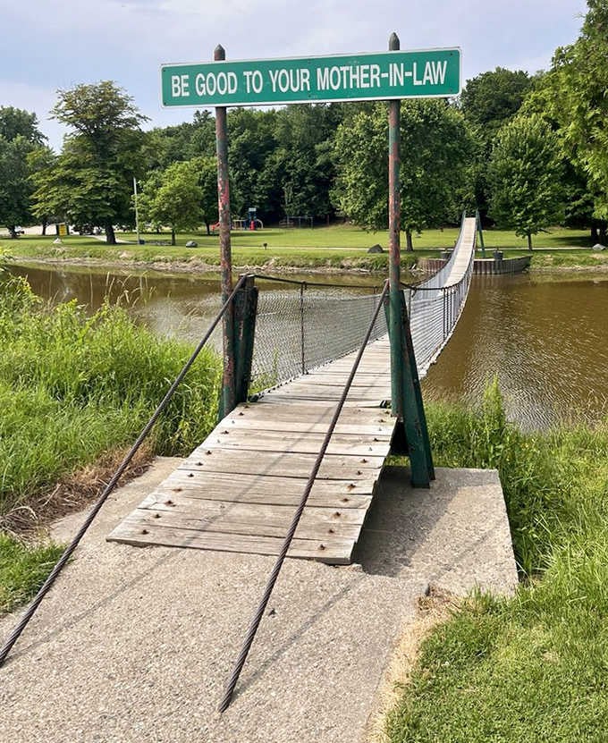 The entrance beckons with promise of adventure, where solid ground gives way to a dance-like crossing experience.