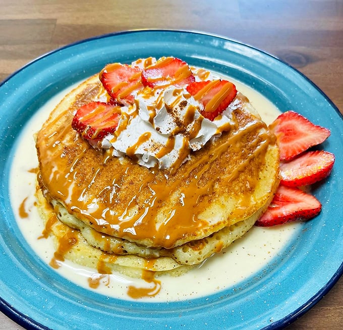 These caramel-drizzled pancakes aren't just breakfast &ndash; they're edible sunshine, topped with fresh strawberries that make Ohio winters momentarily disappear.