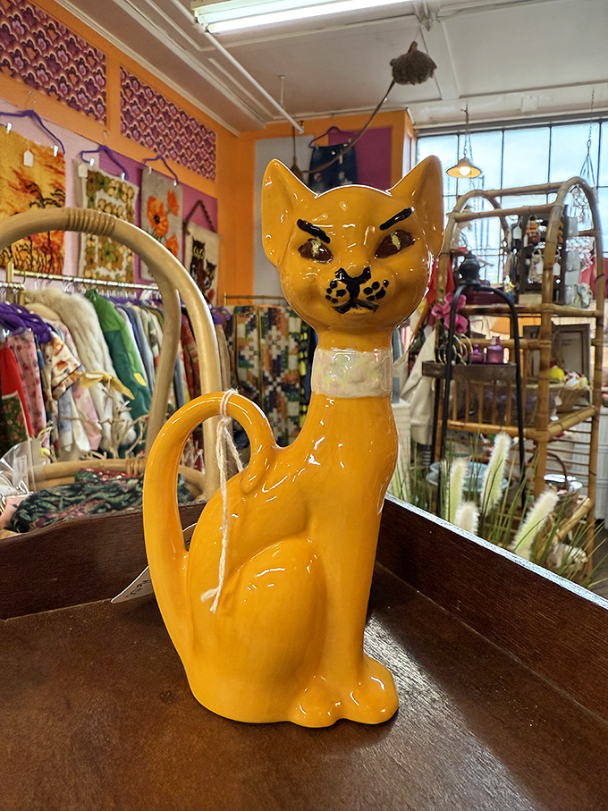 This sassy yellow ceramic cat figurine perfectly captures the quirky personality finds waiting to be discovered &ndash; retro charm with attitude to spare!
