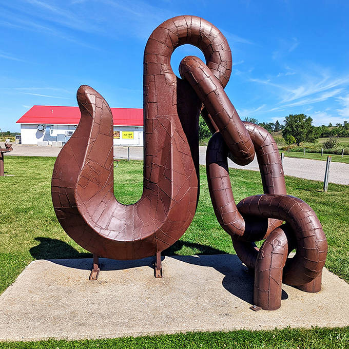 Industrial strength imagination! This massive chain and hook sculpture transforms everyday hardware into a monument of mechanical wonder.