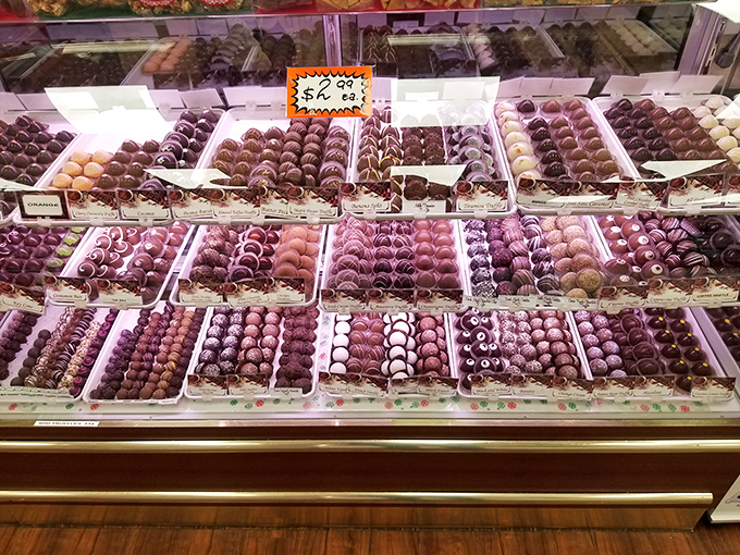 Chocolate truffles lined up like edible jewels, each one promising a moment of bliss that makes adulting temporarily disappear.