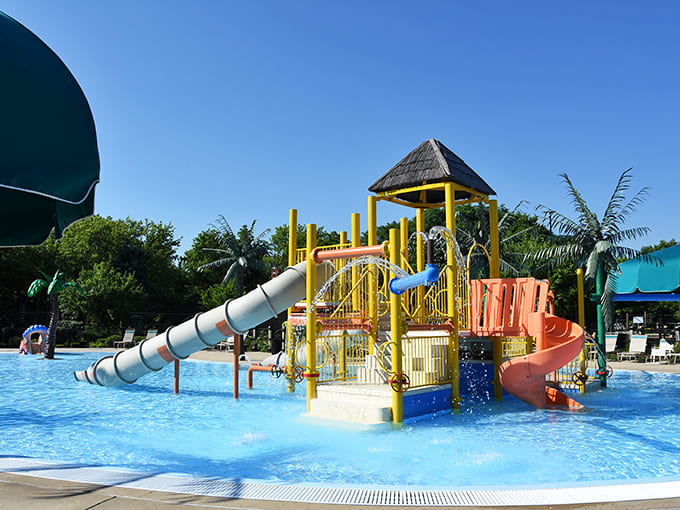 Twisting slides and vibrant play structures beckon thrill-seekers of all ages into a world of watery fun.