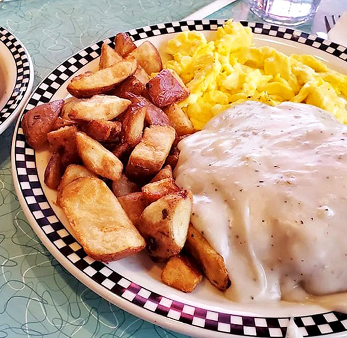 Country steak smothered in gravy with eggs and home fries &ndash; the kind of breakfast that makes you want to hug the cook and take a nap afterward.