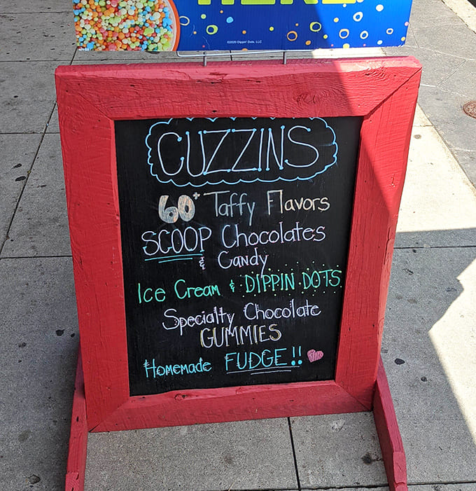 The chalkboard menu promises sixty taffy flavors, which is approximately fifty-nine more than most people knew existed.