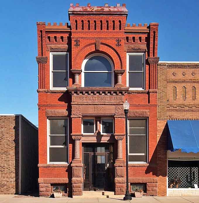 The 1892 First National Bank building stands as a testament to Dawson's rich history, now housing gnome bankers with tiny ledgers.