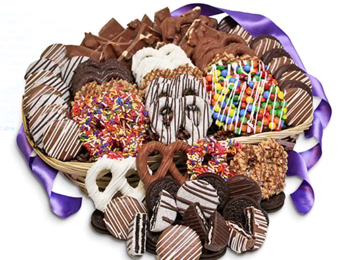 A chocolate lover's dream come true! This basket of hand-dipped treats showcases the artistry behind All City Candy's gourmet chocolate creations.