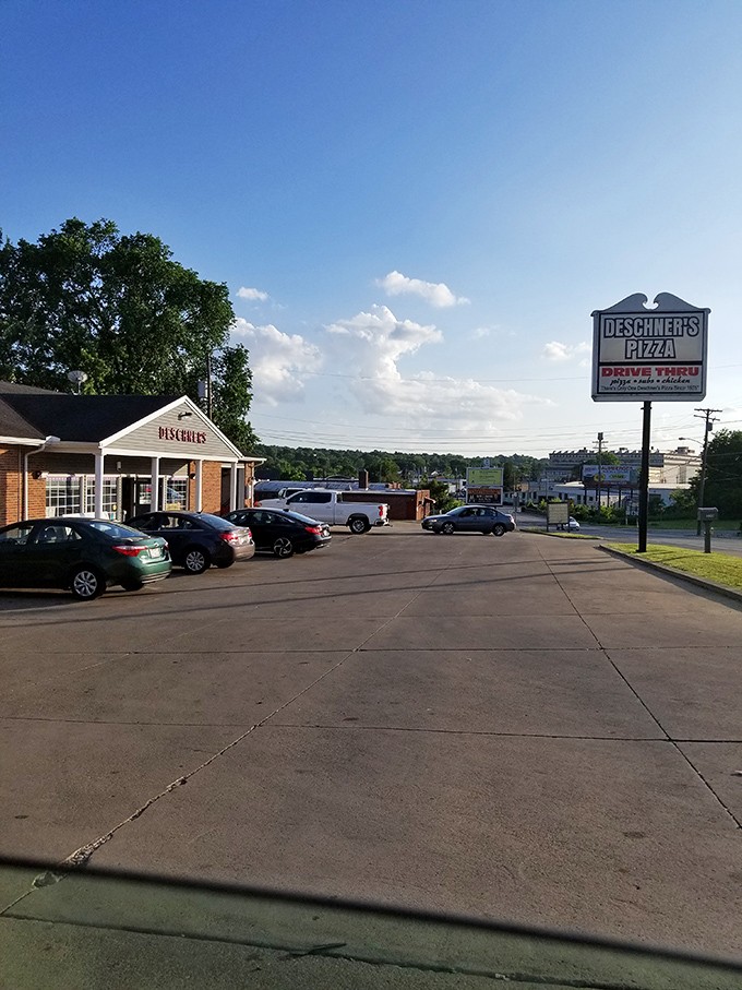 Deschner's Pizza proves that sometimes the most unassuming buildings house the most satisfying slices, with its drive-thru offering convenience without sacrificing quality.