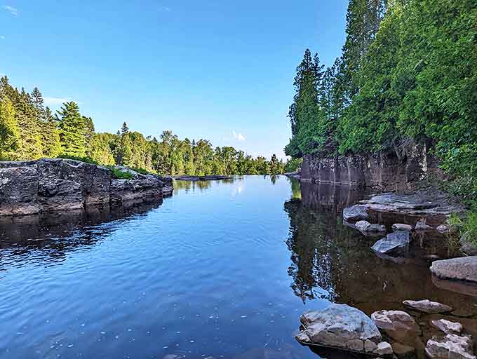 The crystal-clear waters of the Gooseberry River reflect the surrounding forest like nature's own mirror – no filter needed!
