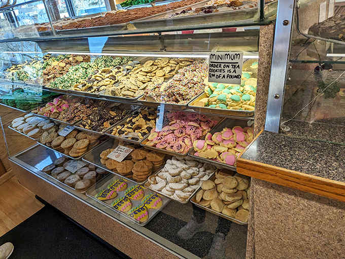 A treasure map of deliciousness awaits behind glass, where cookies, pastries, and donuts compete for your attention and limited stomach space.