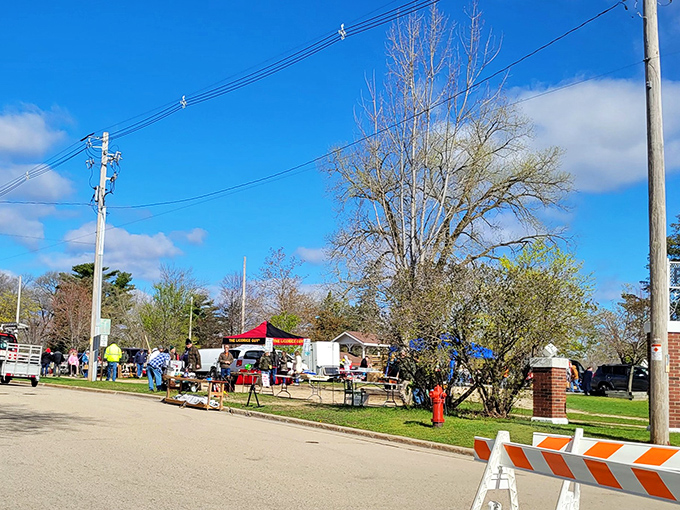 The market sprawls across the park like a colorful village, where every tent holds possibilities and your wallet trembles with anticipation.