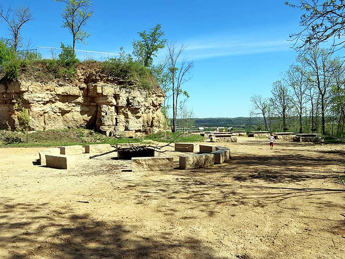 Ancient limestone tells stories: This natural amphitheater at the bluff's base has hosted gatherings since long before European settlers arrived.