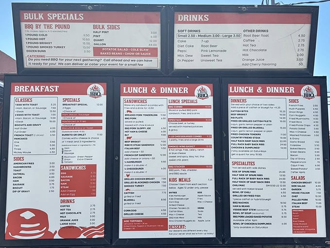 The menu board reads like a love letter to smoked meats, offering everything from breakfast to bulk BBQ for those serious about their protein.