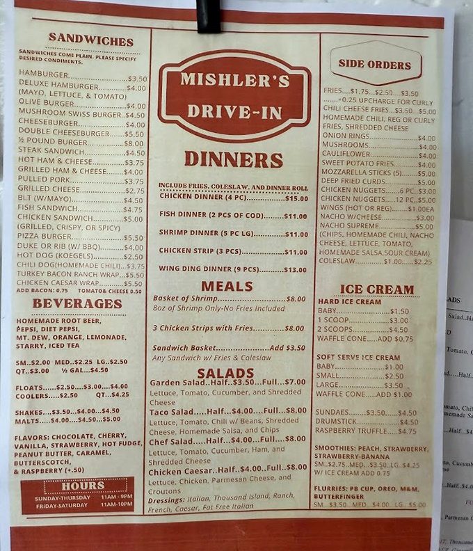 Menu board treasure map: Each item a potential adventure, with the legendary Pizza Burger holding court among classic drive-in favorites.