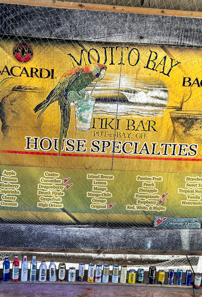 The menu board reads like a passport to flavor destinations&mdash;each mojito variety promising its own mini-vacation in a glass.