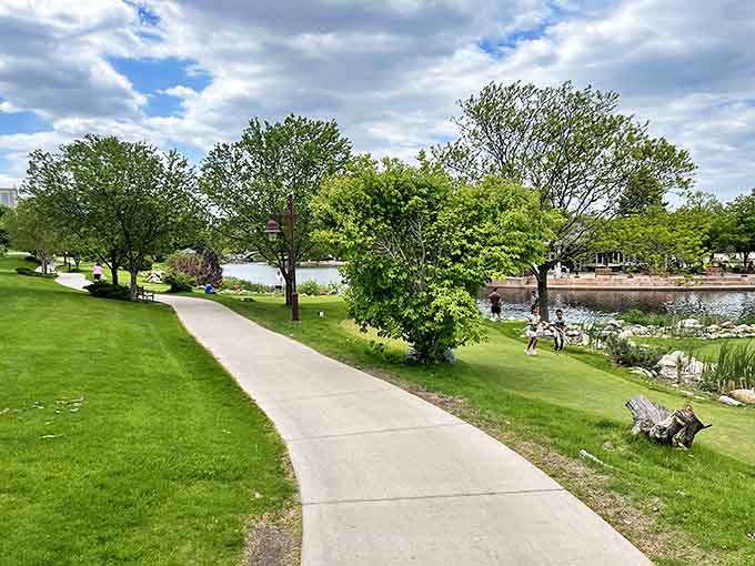 The winding pathway invites leisurely strolls around the lakes, offering different perspectives with each curve and promising new discoveries around every bend.