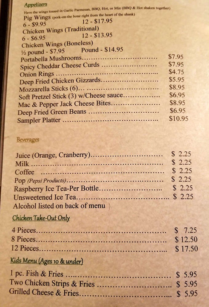 The appetizer selection showcases hearty Midwestern favorites, from cheese curds to portabella mushrooms, setting the stage for a memorable meal.