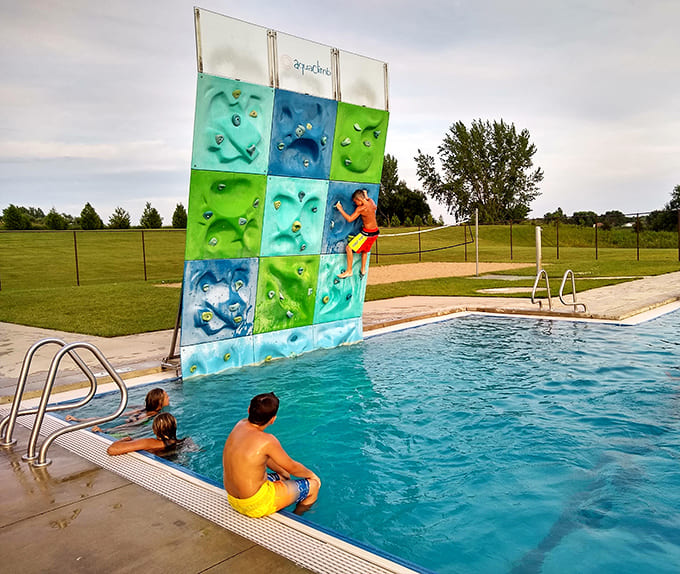 Nothing says "I've got this" quite like attempting a climbing wall while your friends watch from below, cameras ready.