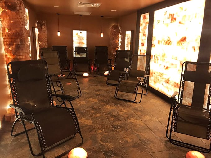 Zero-gravity recliners invite deep relaxation as you breathe in the salt-infused air during a halotherapy session.