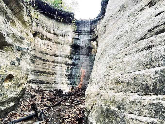 Nature's secret passageway reveals itself between ancient limestone walls, where water has carved its patient masterpiece over millennia.