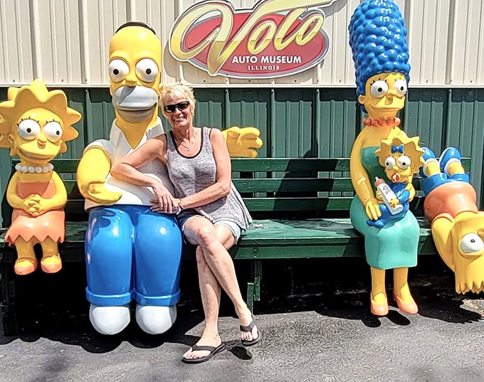 The Simpsons family takes a break outside the Volo Auto Museum entrance &ndash; pop culture nostalgia meets automotive history in this unique Illinois attraction.