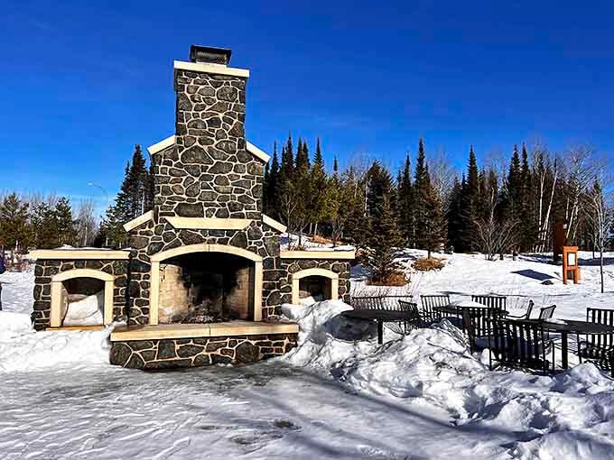 Winter's gathering place: This stone fireplace stands ready to warm frost-nipped fingers and provide the perfect backdrop for hot cocoa and trail tales.