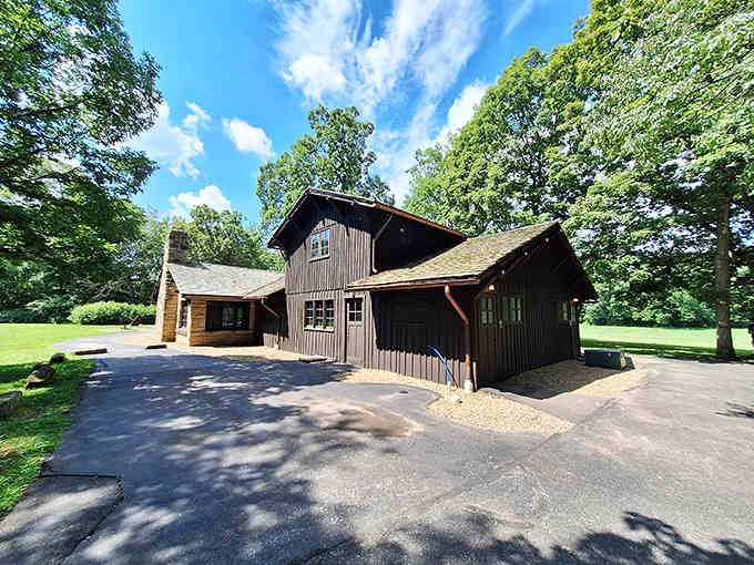 This rustic wooden shelter stands as a testament to human craftsmanship nestled within nature's grand design.