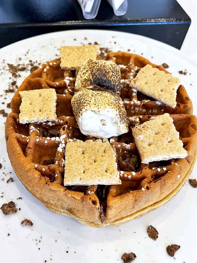 This s'mores waffle isn't just dessert&mdash;it's a campfire memory transformed into breakfast form, complete with perfectly toasted marshmallows that'll make you swoon.