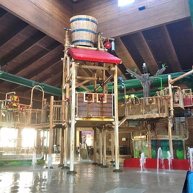 Engineering meets imagination in this wooden water fortress, complete with that mischievous barrel perched atop, ready to drench unsuspecting guests below.