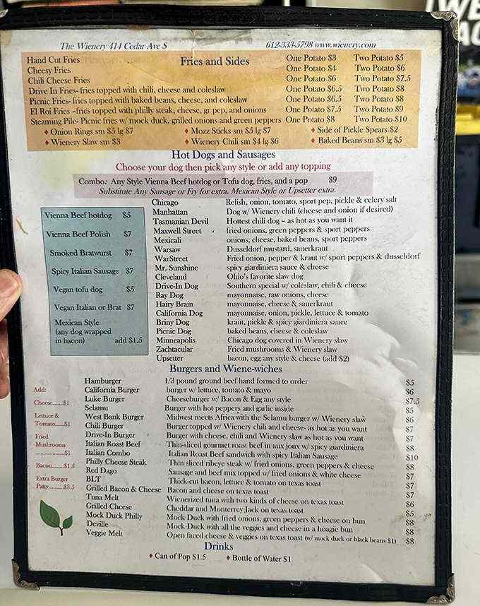 The extensive menu board showcases regional hot dog variations, from Chicago-style to the fiery Tasmanian Devil, plus burgers and breakfast served all day.