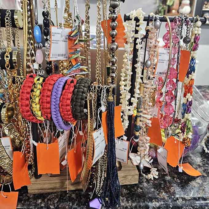 Colorful bracelets and necklaces fill this display, offering a vibrant mix of vintage treasures to explore.