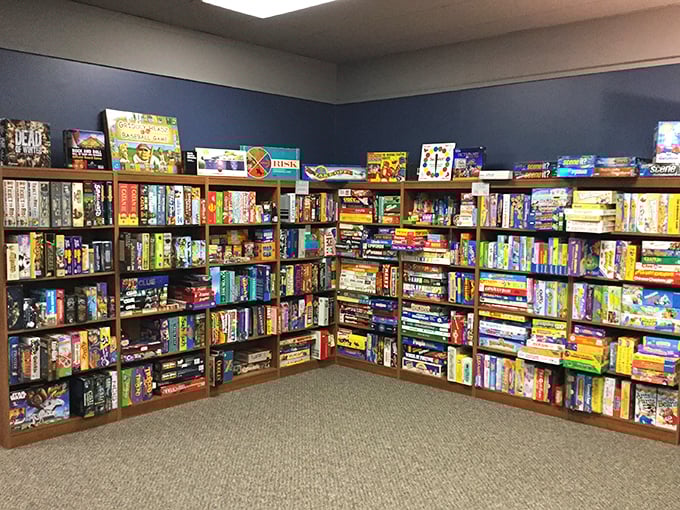 Wall-to-wall wonderland of board games creates a kaleidoscope of possibilities, each box containing worlds waiting to be explored.