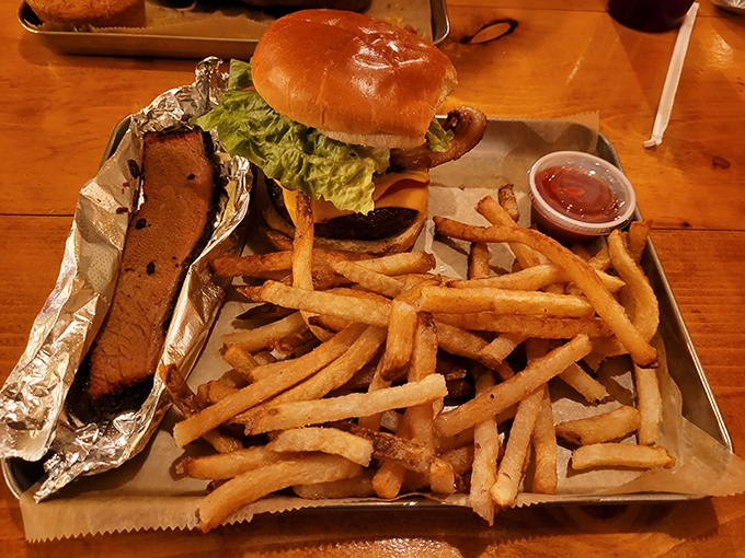 This isn't just a burger &ndash; it's architecture, engineering, and art all on one plate, with a side of golden fries that crunch like autumn leaves.