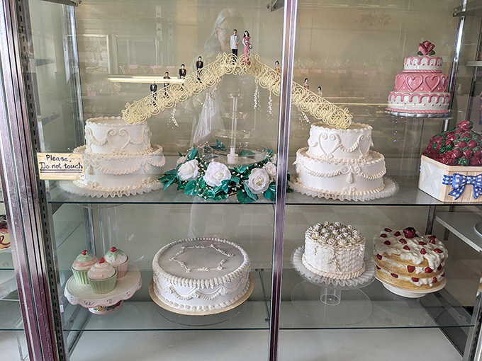 Wedding cake dreams come true in this elegant display. The intricate detailing shows why celebrations throughout the region feature these showstoppers.