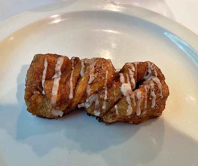 The legendary cinnamon twist in all its glory &ndash; layers of buttery dough embraced by cinnamon-sugar and drizzled with just enough glaze to make you weak in the knees.