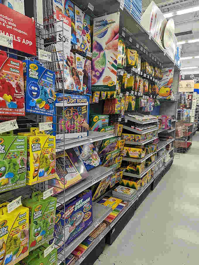 The coloring supplies aisle, where Crayola dreams come true and adults rediscover the simple joy of staying inside the lines.