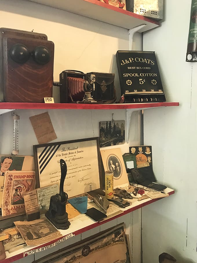 Presidential certificates and vintage advertisements share shelf space with everyday tools, each telling stories of American ingenuity.