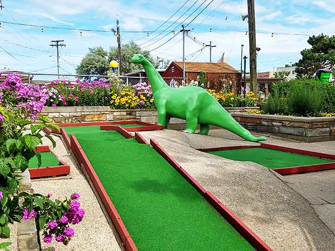 This friendly green dinosaur doesn't bite, but he might just swallow your golf ball if your aim is as prehistoric as he is.