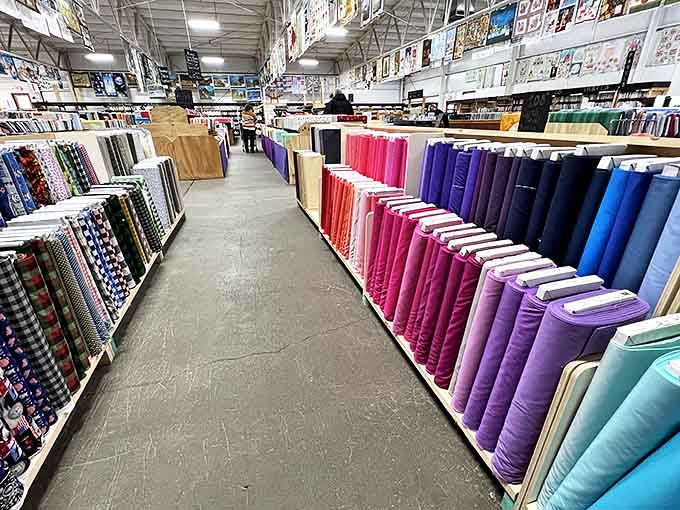 Navigating these fabric-filled aisles feels like wandering through a textile museum where touching is not only allowed but encouraged.