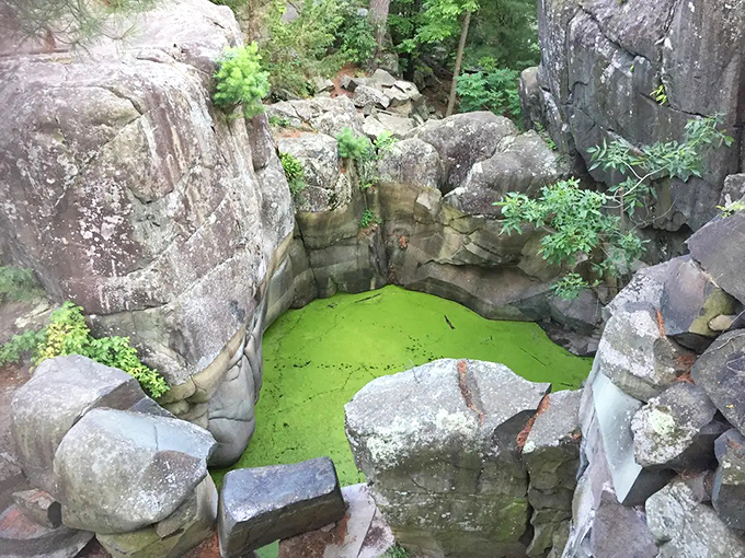 Nature's perfect potholes: where swirling glacial waters played sculptor, creating mysterious green pools in solid rock that defy explanation.