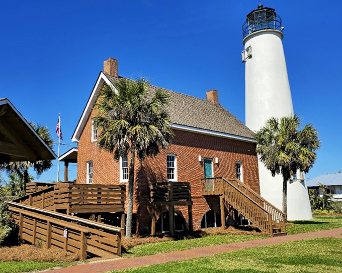 The classic pairing of white lighthouse tower and red brick keeper's house creates that quintessential coastal scene that has launched a thousand jigsaw puzzles.